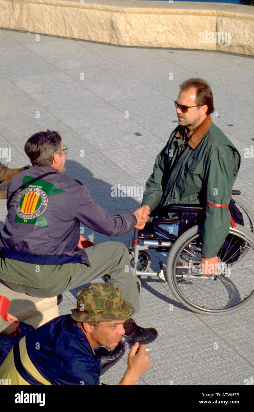 Legless wheelchair veteran age 55 shaking hands at Minnesota Vietnam ...