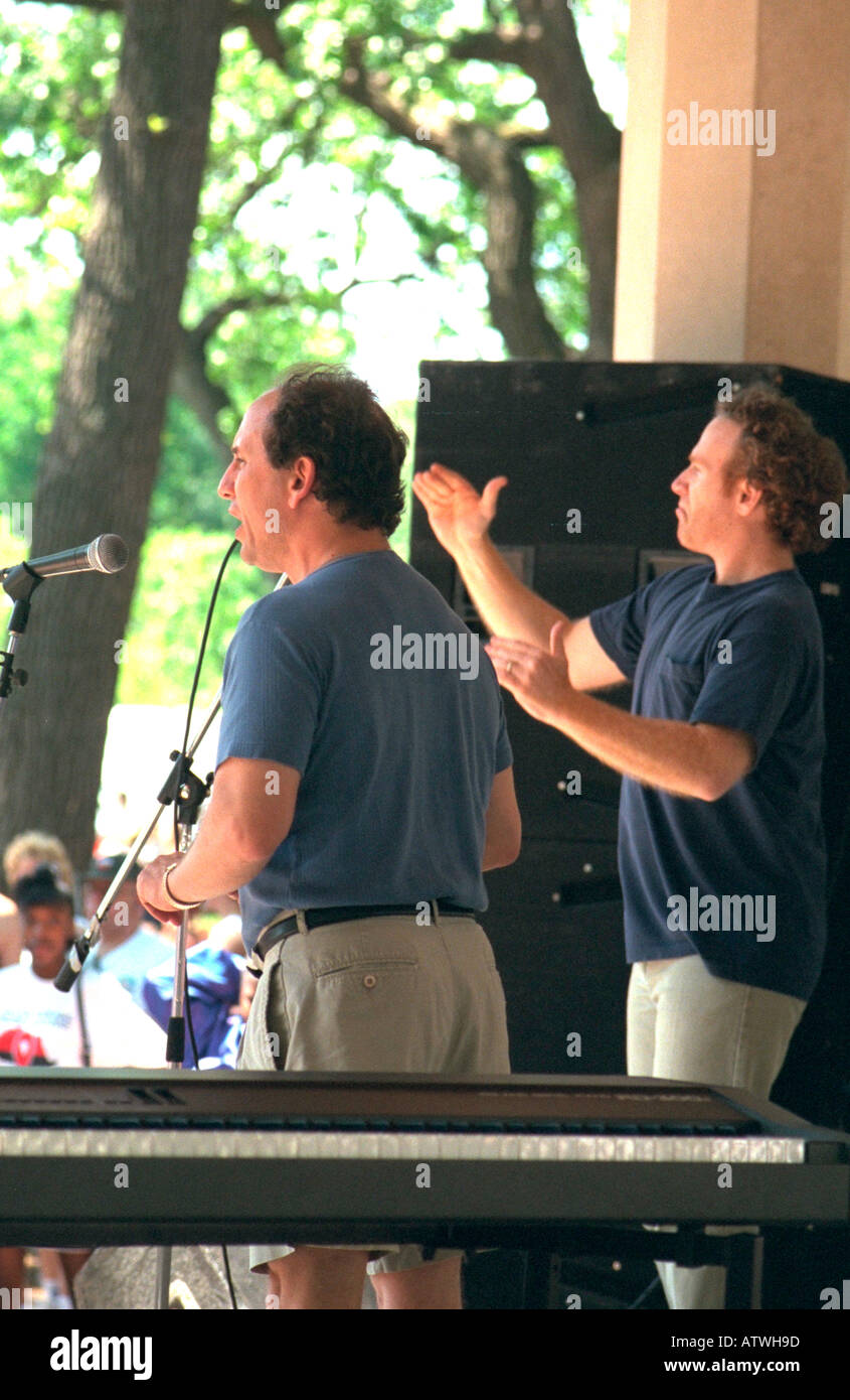 Senator Paul Wellstone and signer age 25 speaking at AIDS Walk ceremony ...