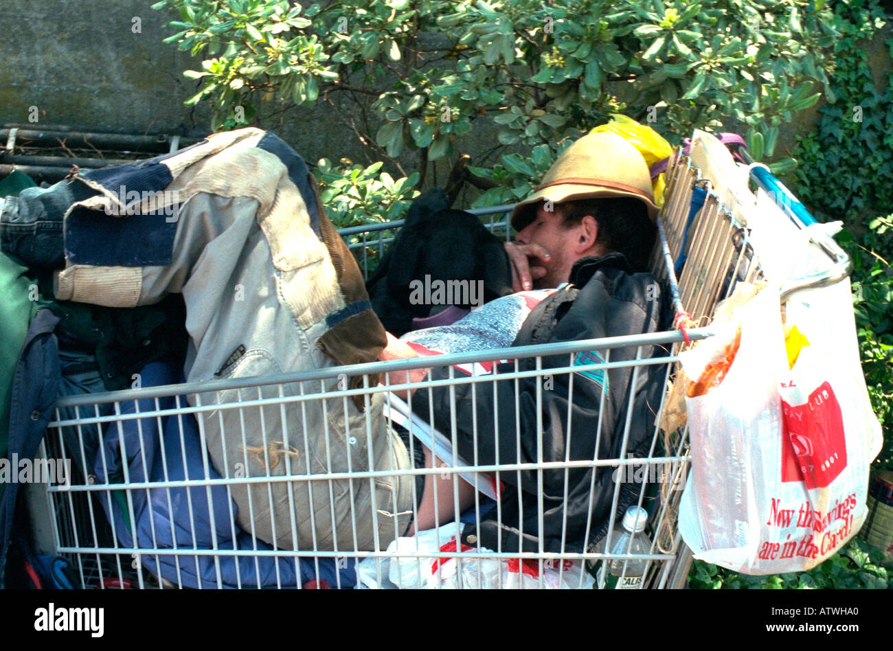 Homeless man with shopping cart hi-res stock photography and images - Alamy
