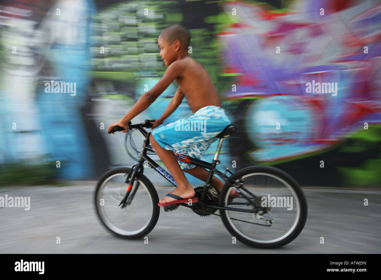 Favela children on bicycle and graffiti, Rio de Janeiro, Brazil, South ...