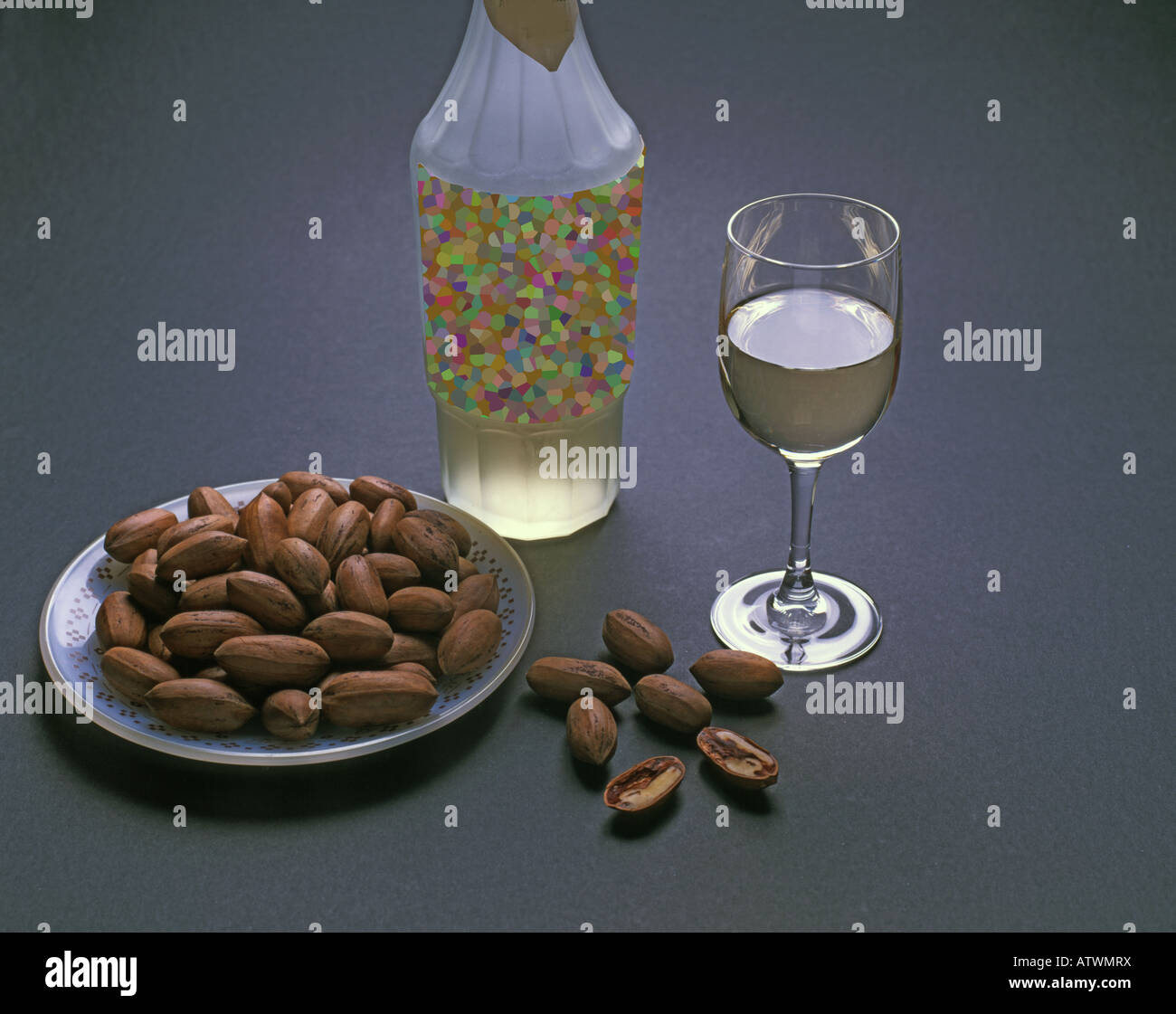 Bottle glass liquor drink nuts Stock Photo - Alamy