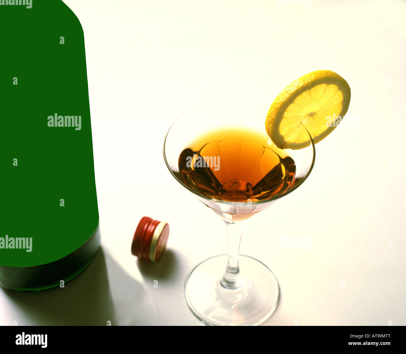 Aperitif drink slice of lemon bottle and capsule Stock Photo - Alamy