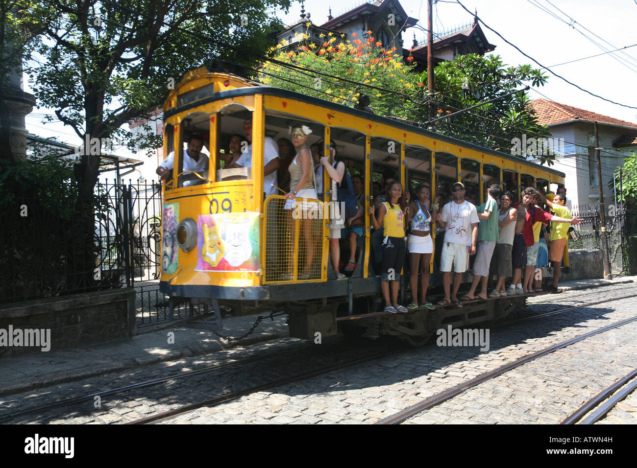 Yellow traditional bonde tram transport in street of Santa Teresa, Rio ...
