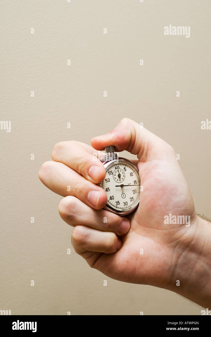 Hand holding stopwatch chronometer Stock Photo - Alamy