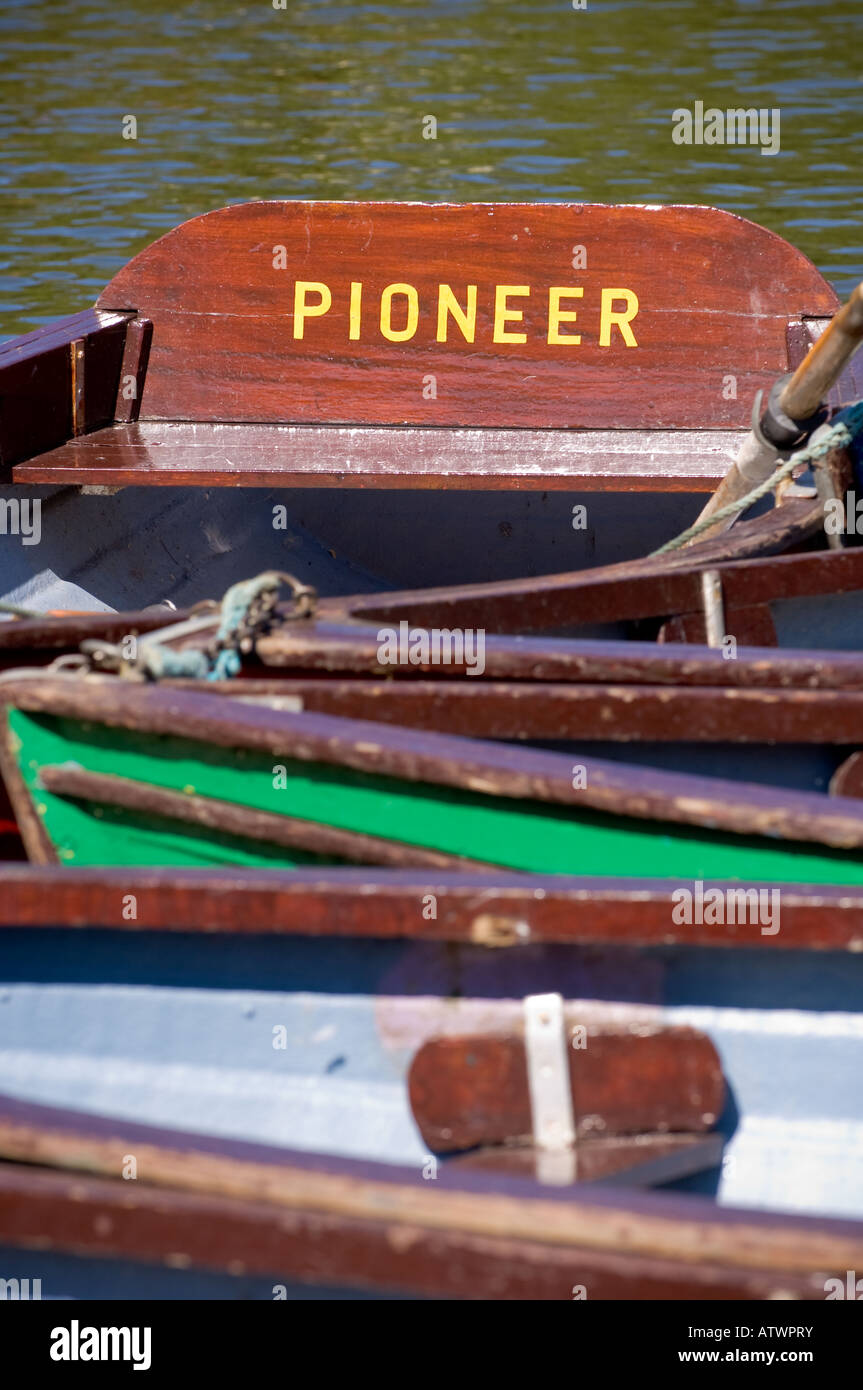 Wooden nameplate on the stern of a rowing boat called Pioneer Stock ...