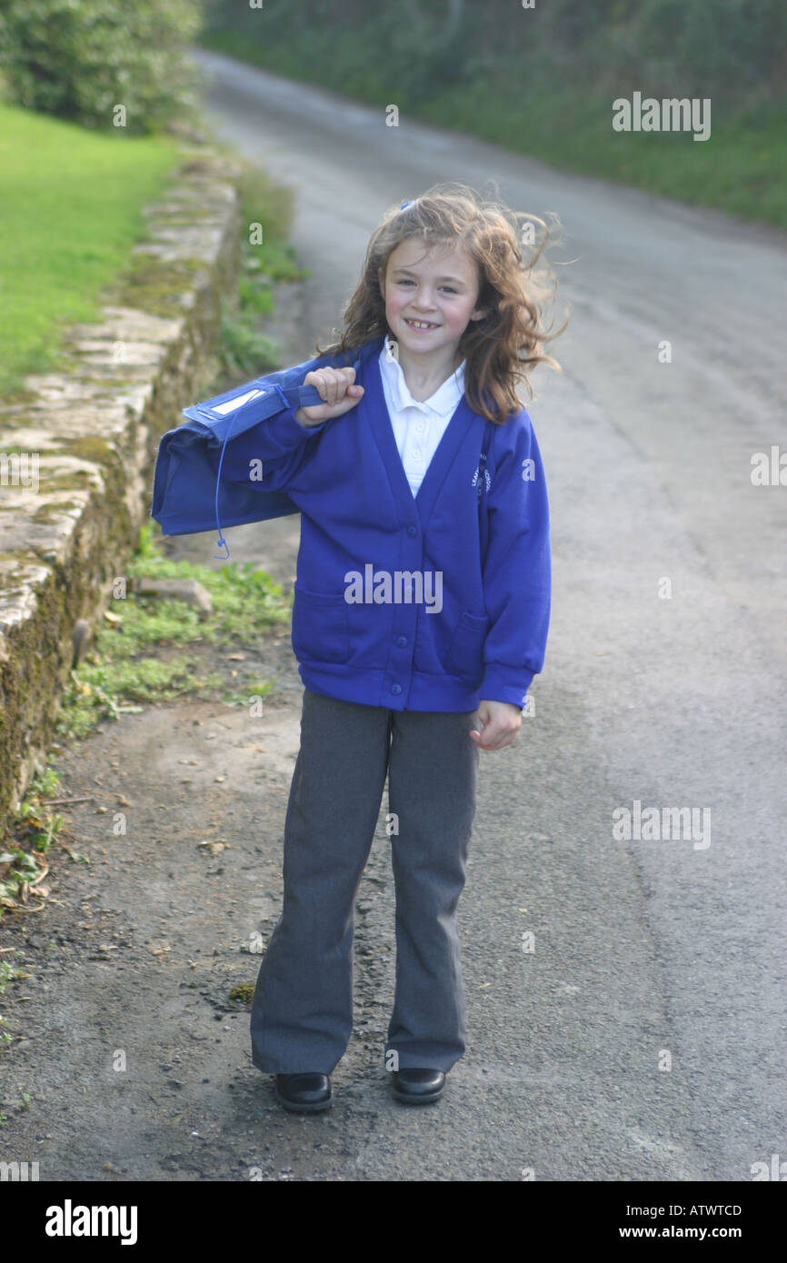 A young girl walking home from school Stock Photo - Alamy