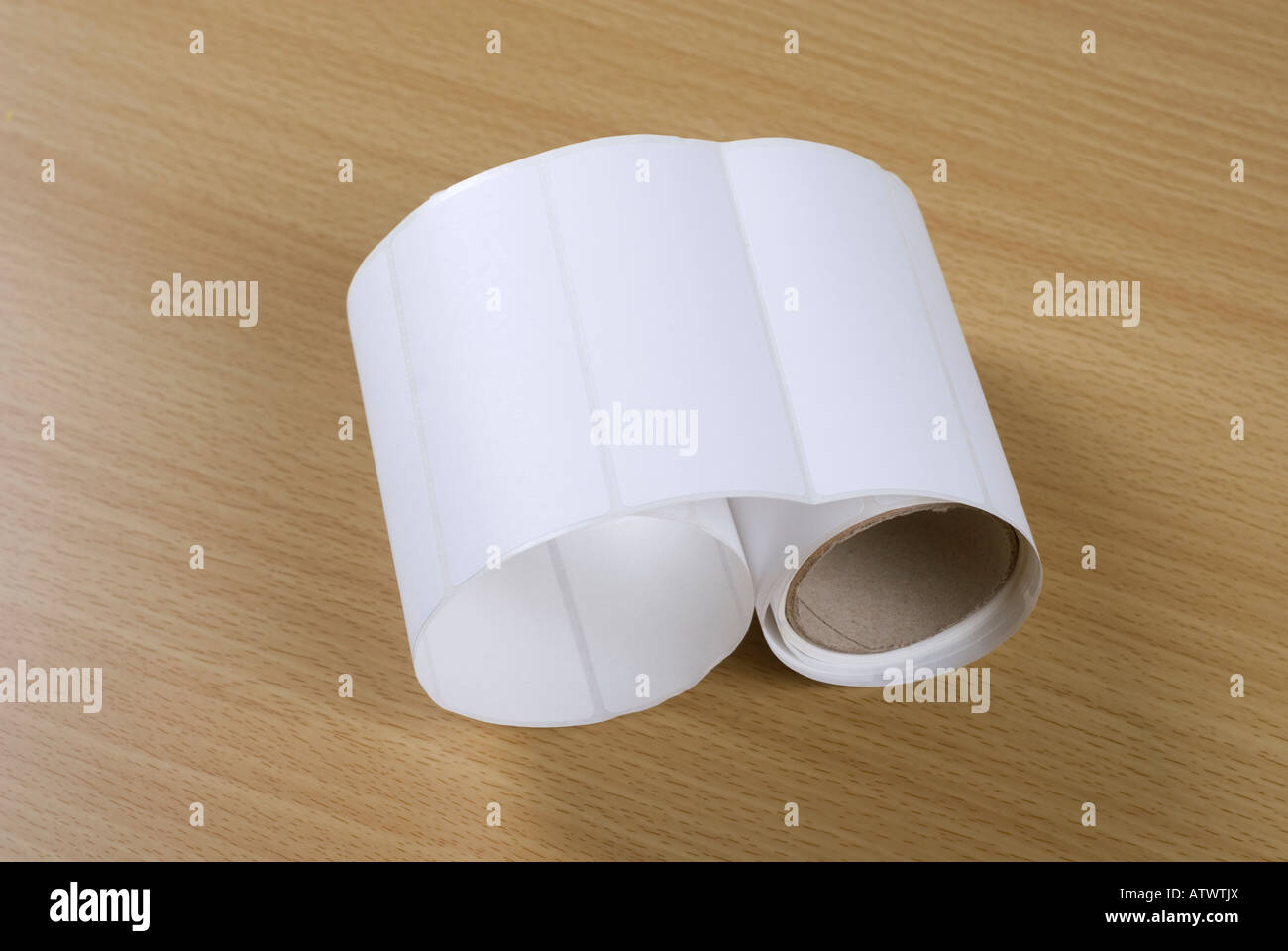 Roll of white paper labels Stock Photo - Alamy