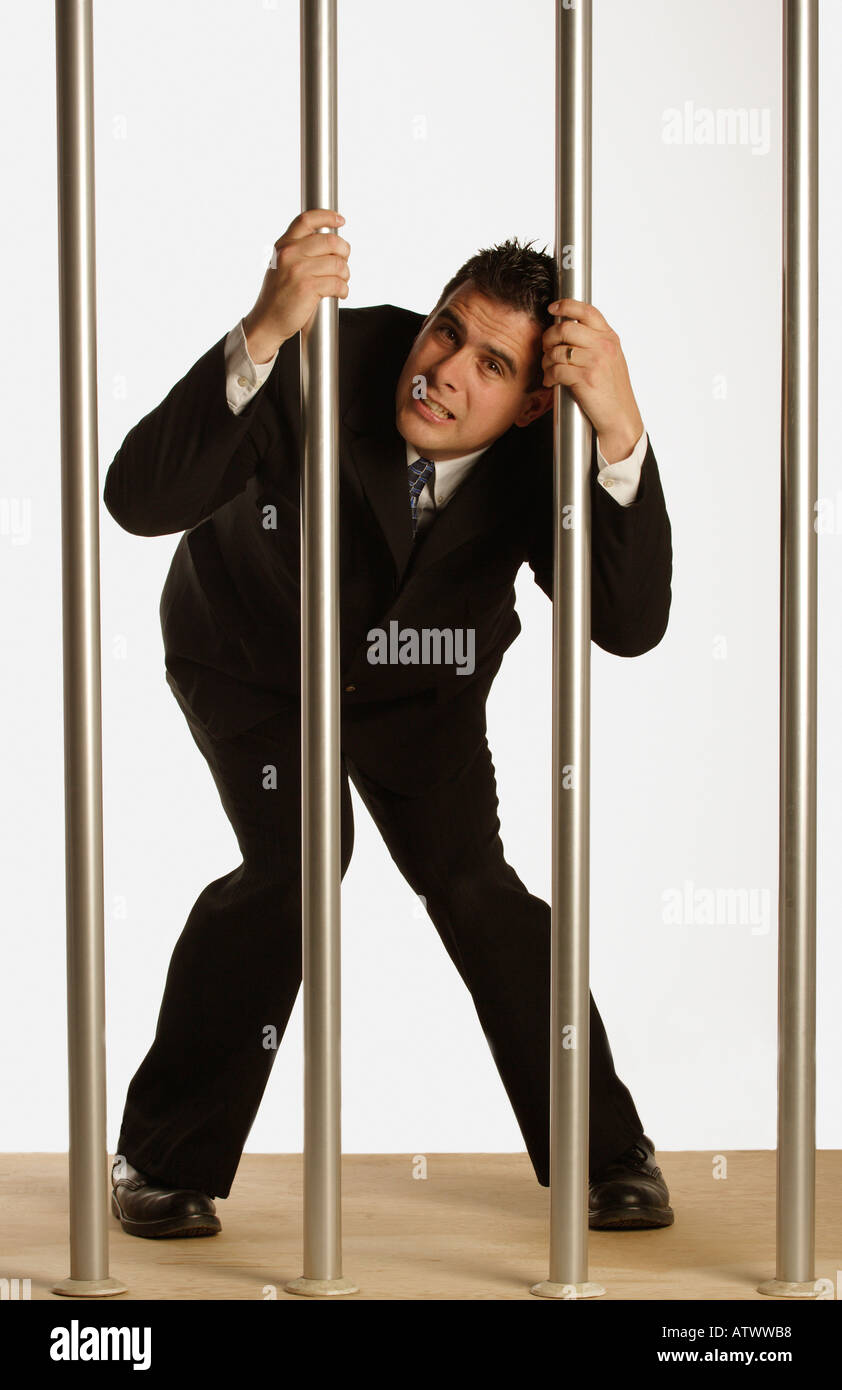 Portrait young man behind bars hi-res stock photography and images - Alamy