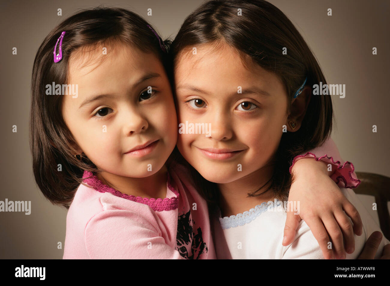 Two sisters hugging Stock Photo - Alamy