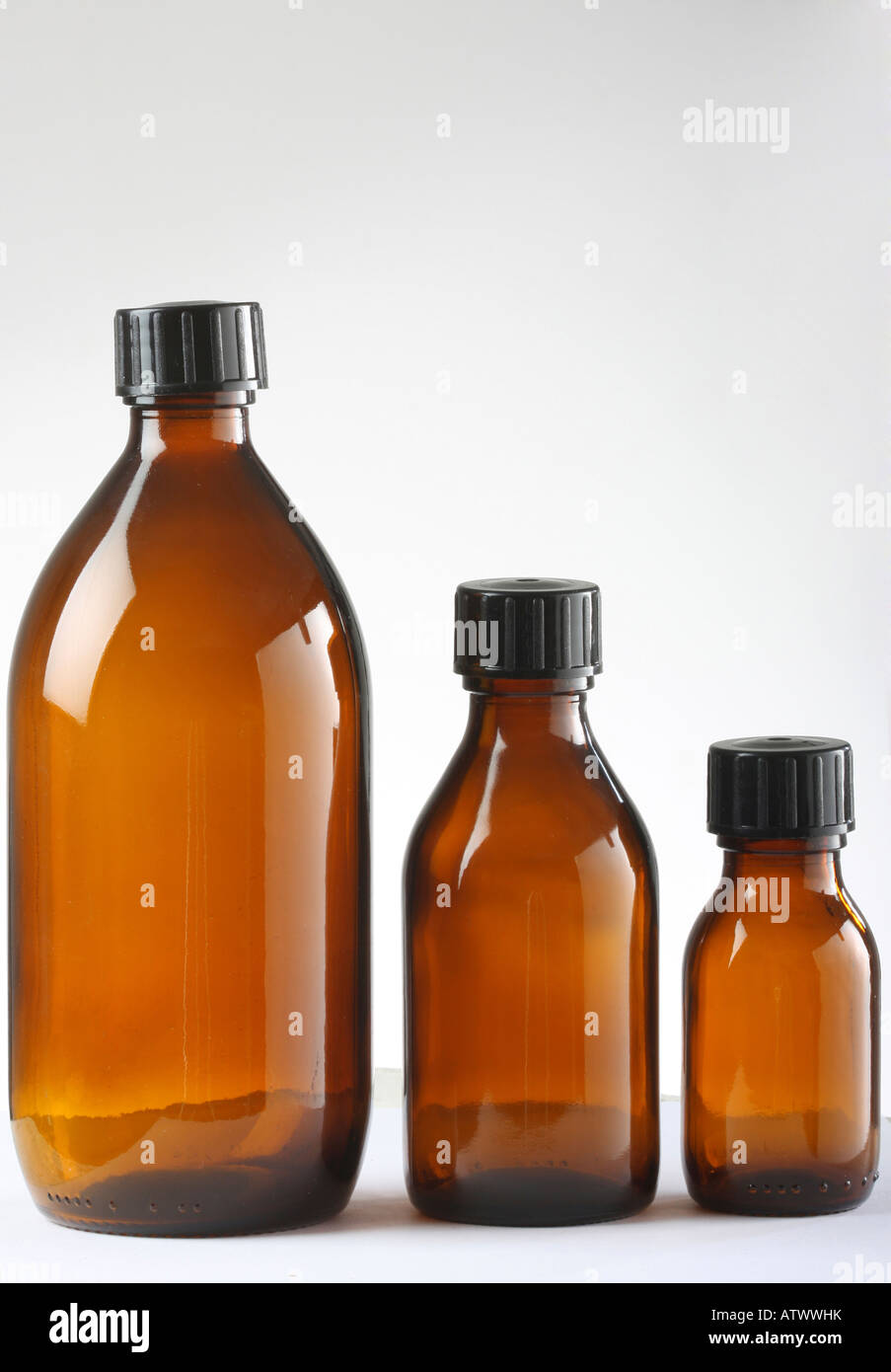 Three brown medicine bottles shot in studio Stock Photo - Alamy