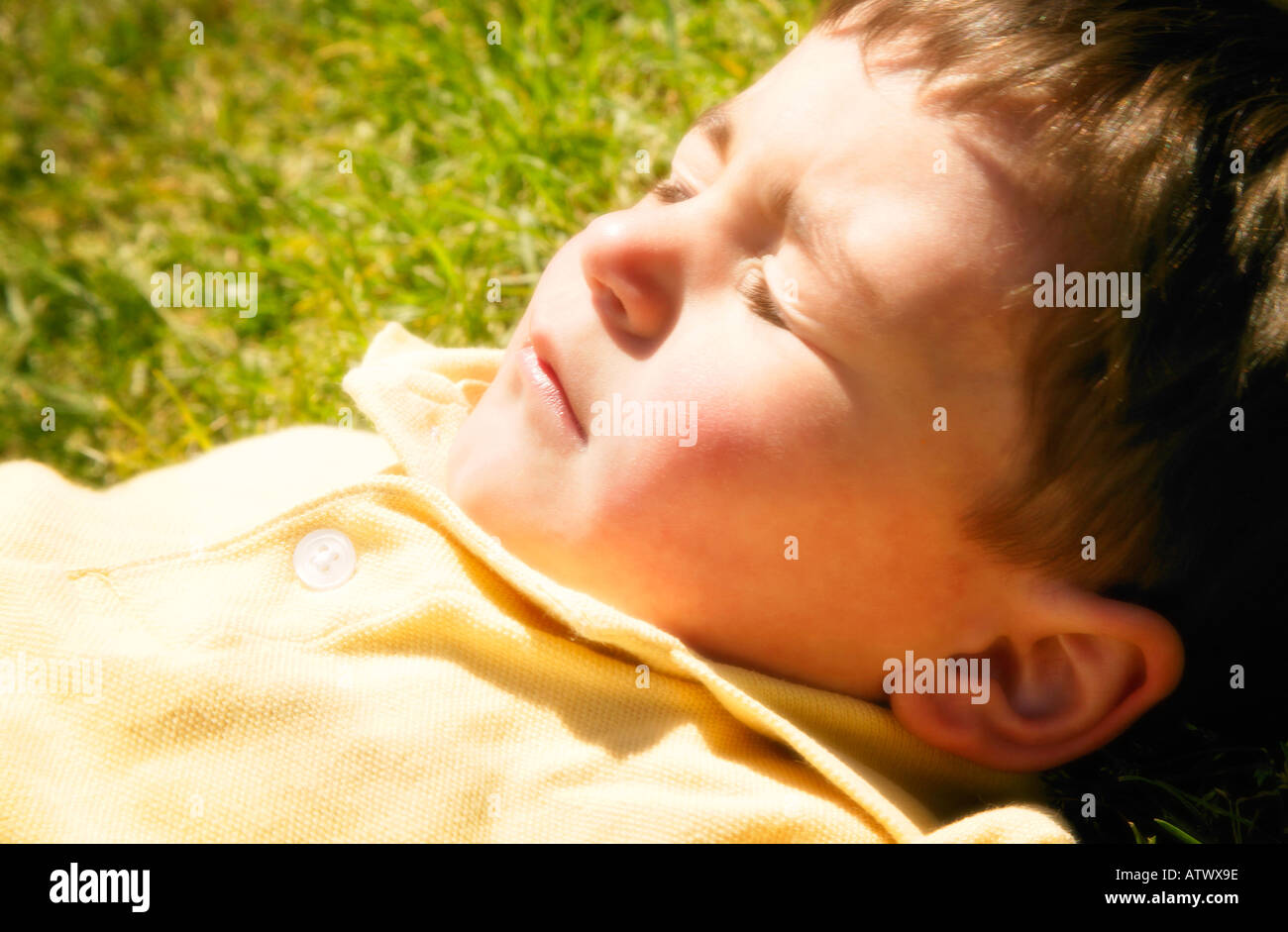 Child squinting sun hi-res stock photography and images - Alamy