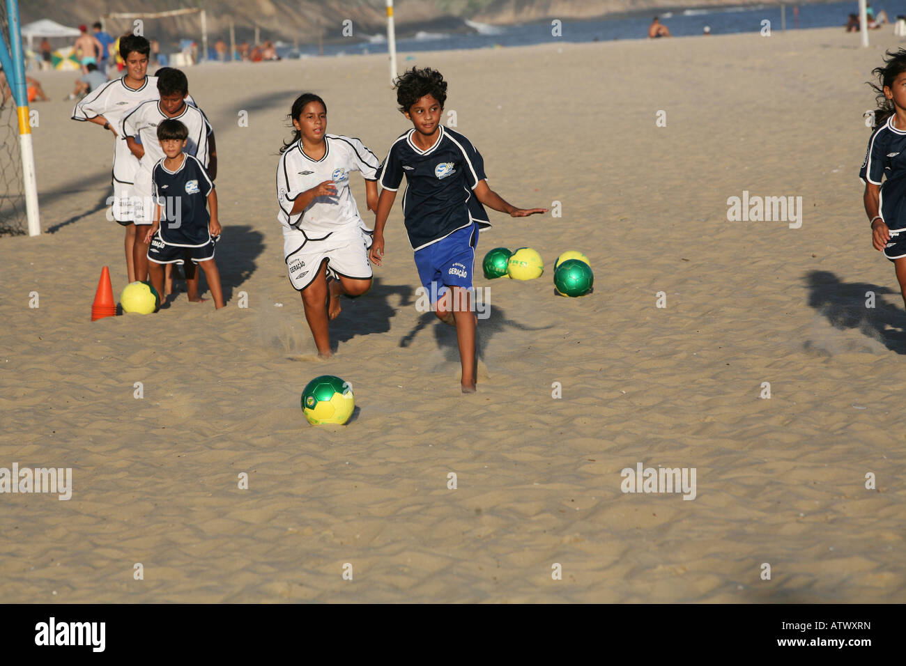 Kids Playing Soccer On The Beach