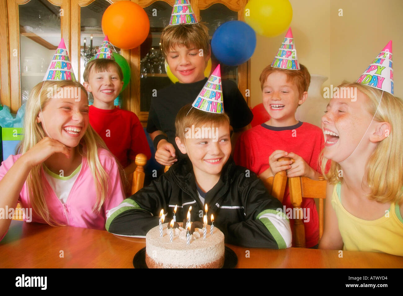 A group of children celebrating a birthday Stock Photo - Alamy