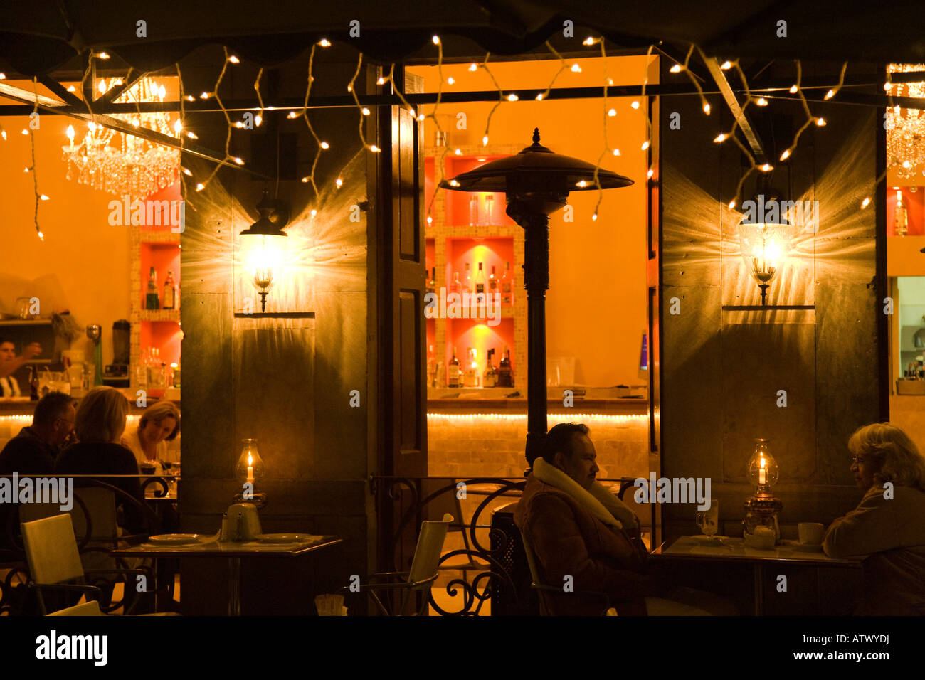 MEXICO Guanajuato People dining outdoors at night Hotel Luna bar and ...