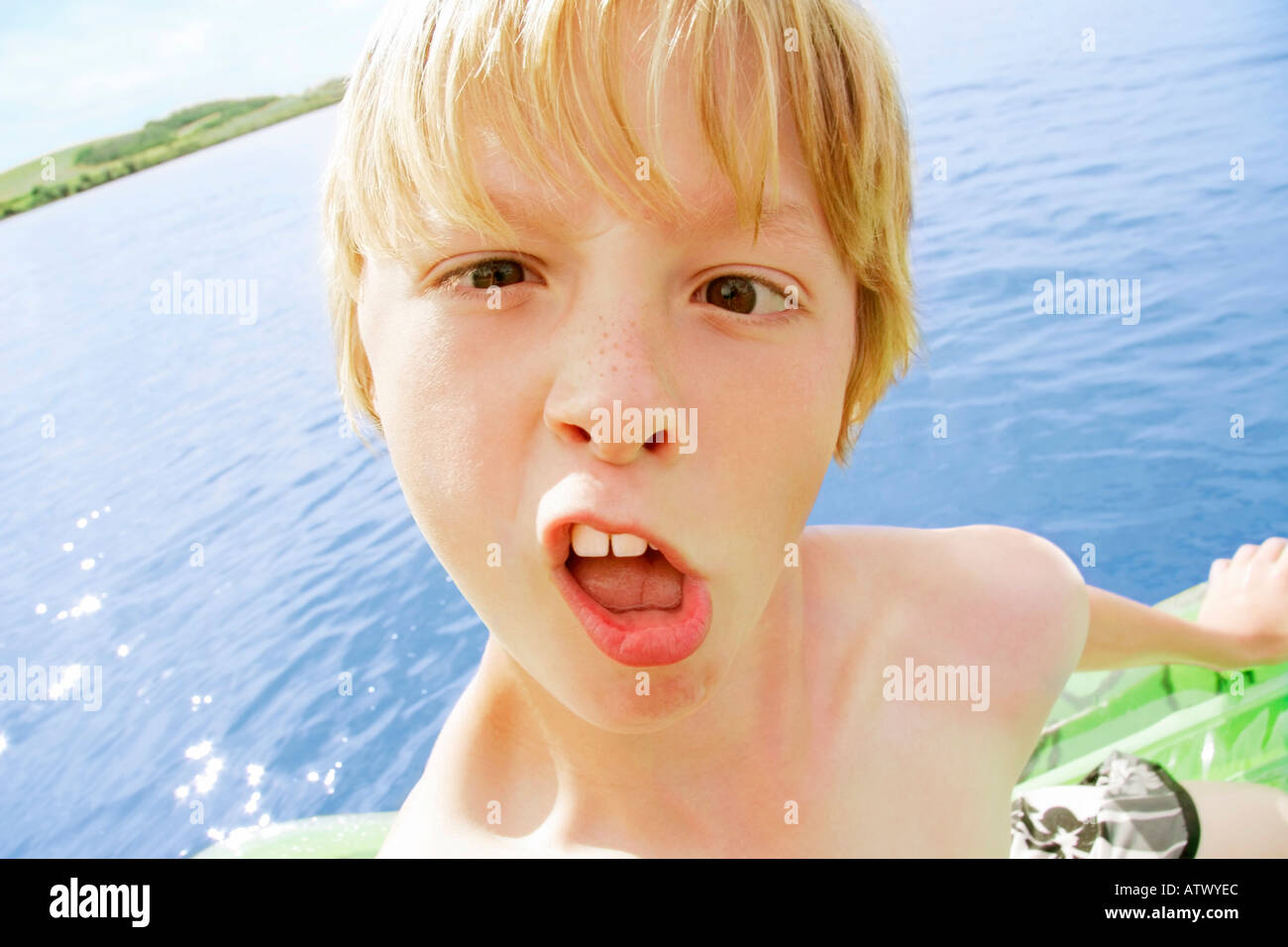 A young boy making a funny face Stock Photo - Alamy