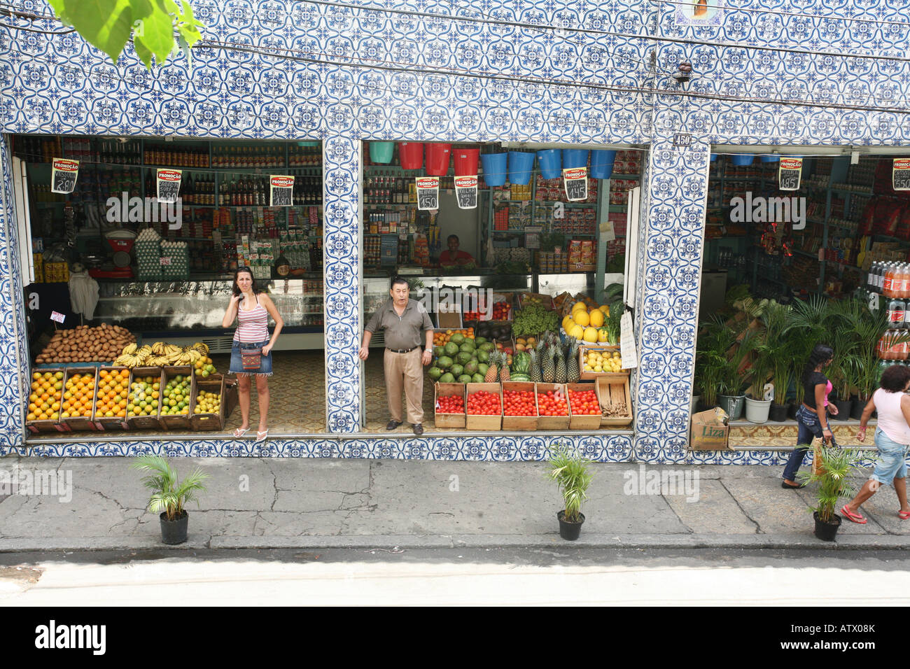 Pretty blue tiled shop selling fruit and vegetables on the main street ...
