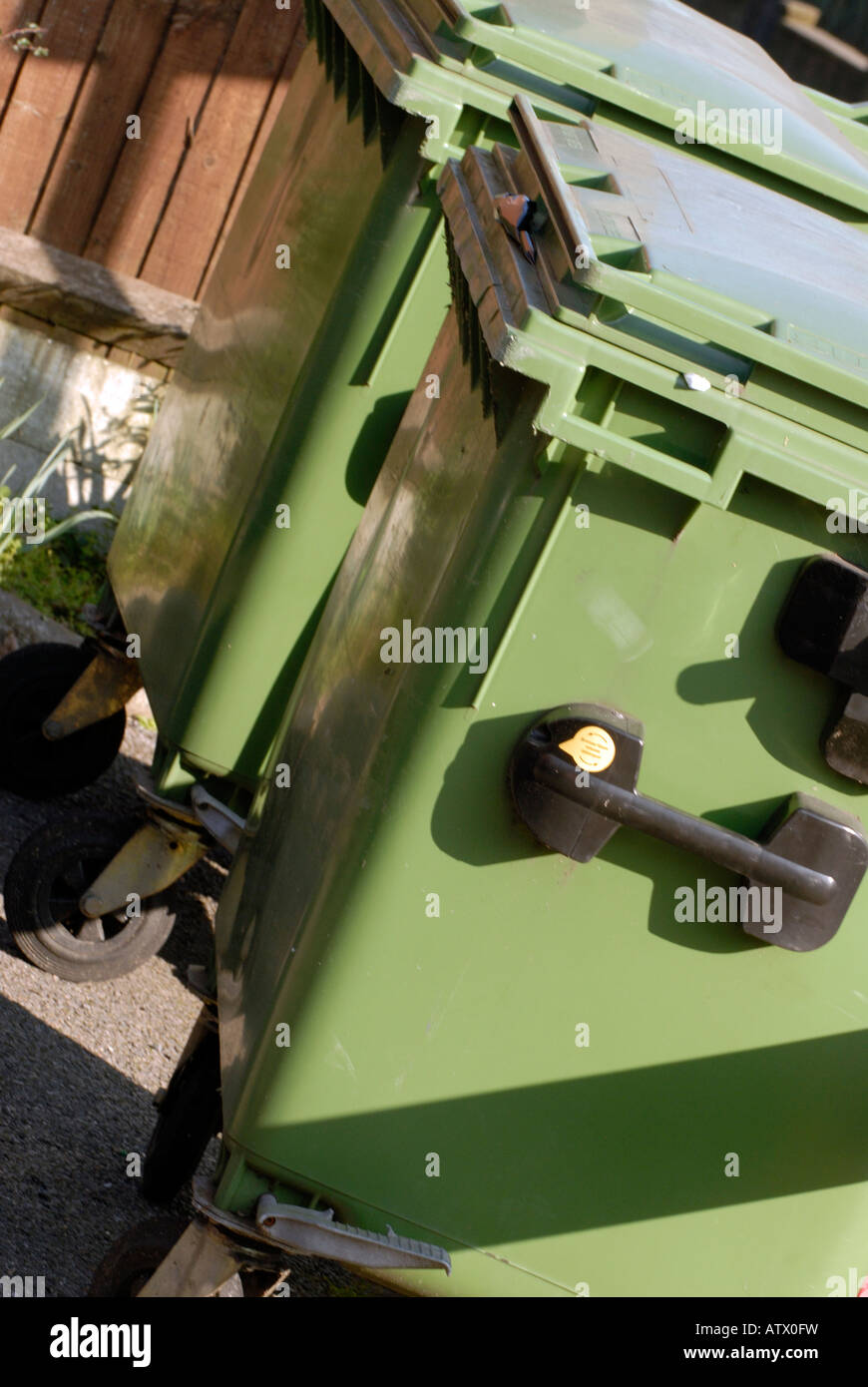 green wheelie bins recycling containers outside of commercial waste ...