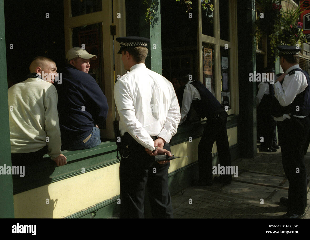 Police outside London pub on day of football match Stock Photo - Alamy