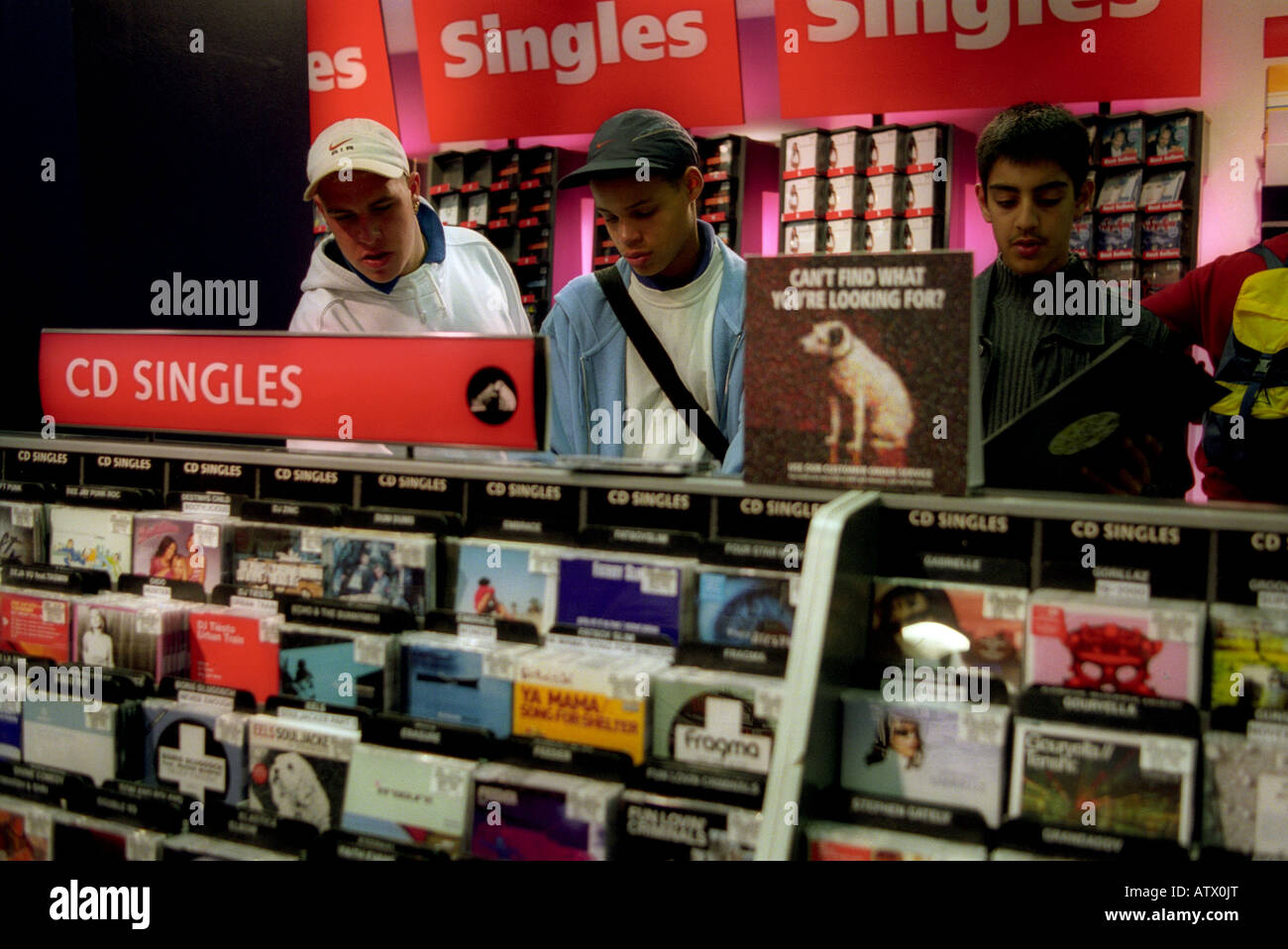 Kids looking for CDs in music shop Stock Photo - Alamy