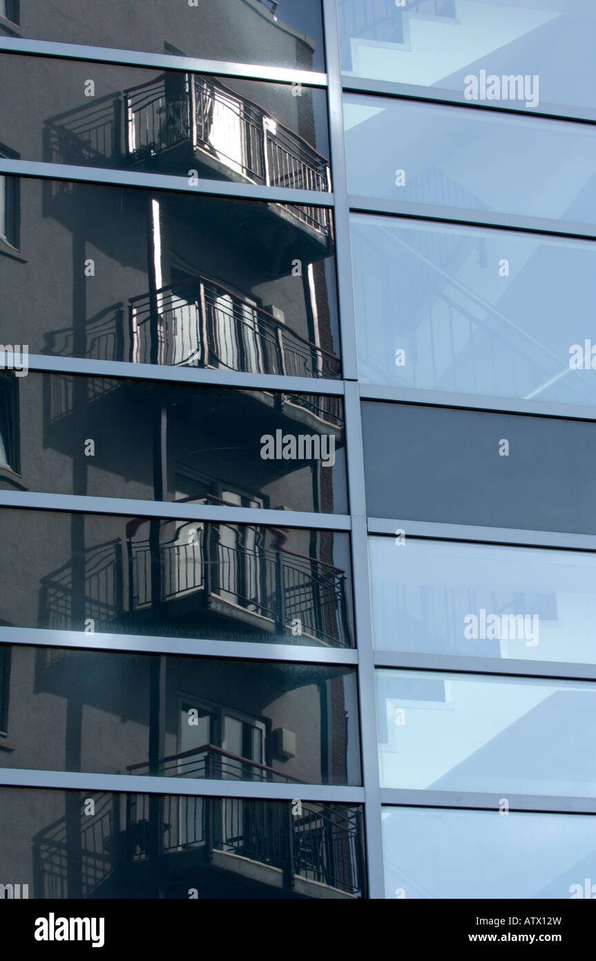 a modern building block of offices or flats with glass frontage showing ...