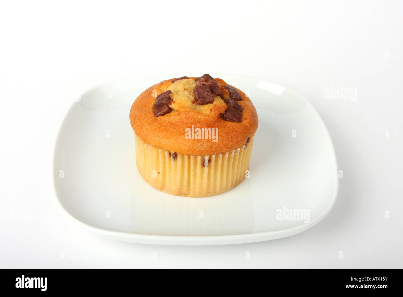 cupcake on a white plate isolated on white shot in studio Stock Photo ...