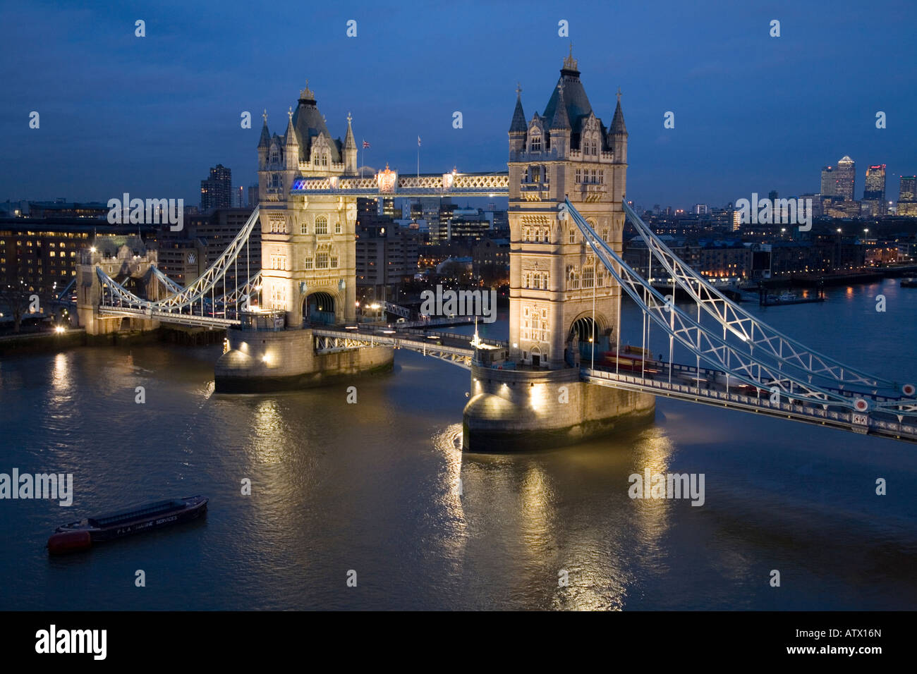 Evening and elevated night photograph view of Tower Bridge, which spans ...