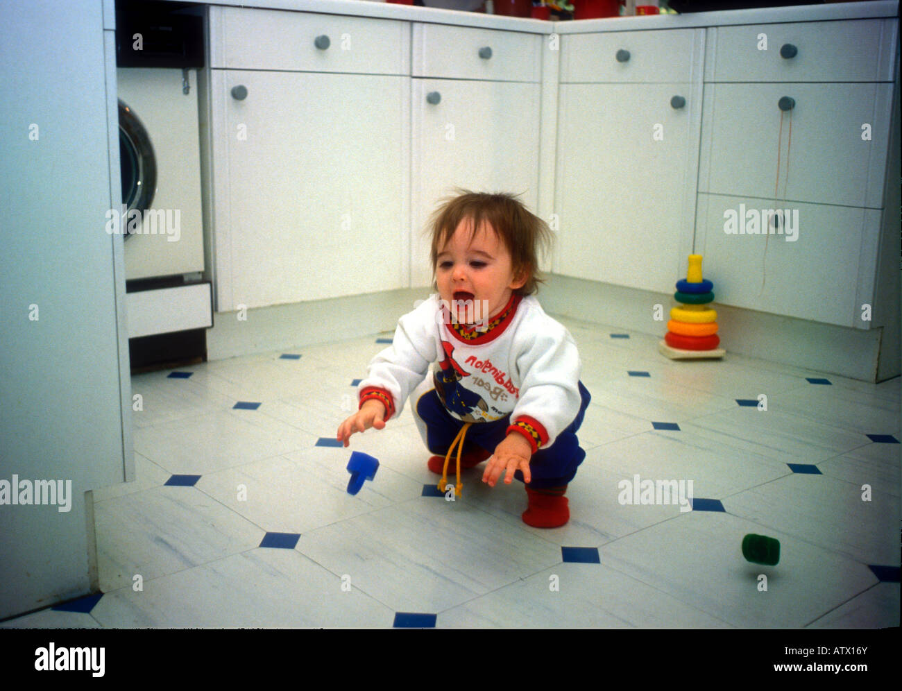 Young toddler learning to walk Stock Photo - Alamy