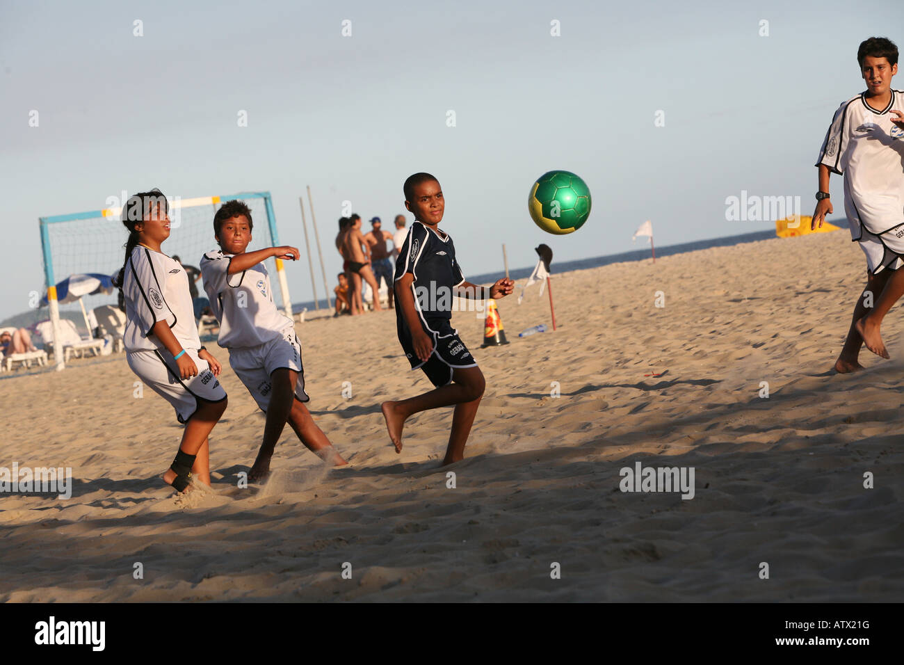 School children play football on Copacabana Beach, Rio de Janeiro Stock ...