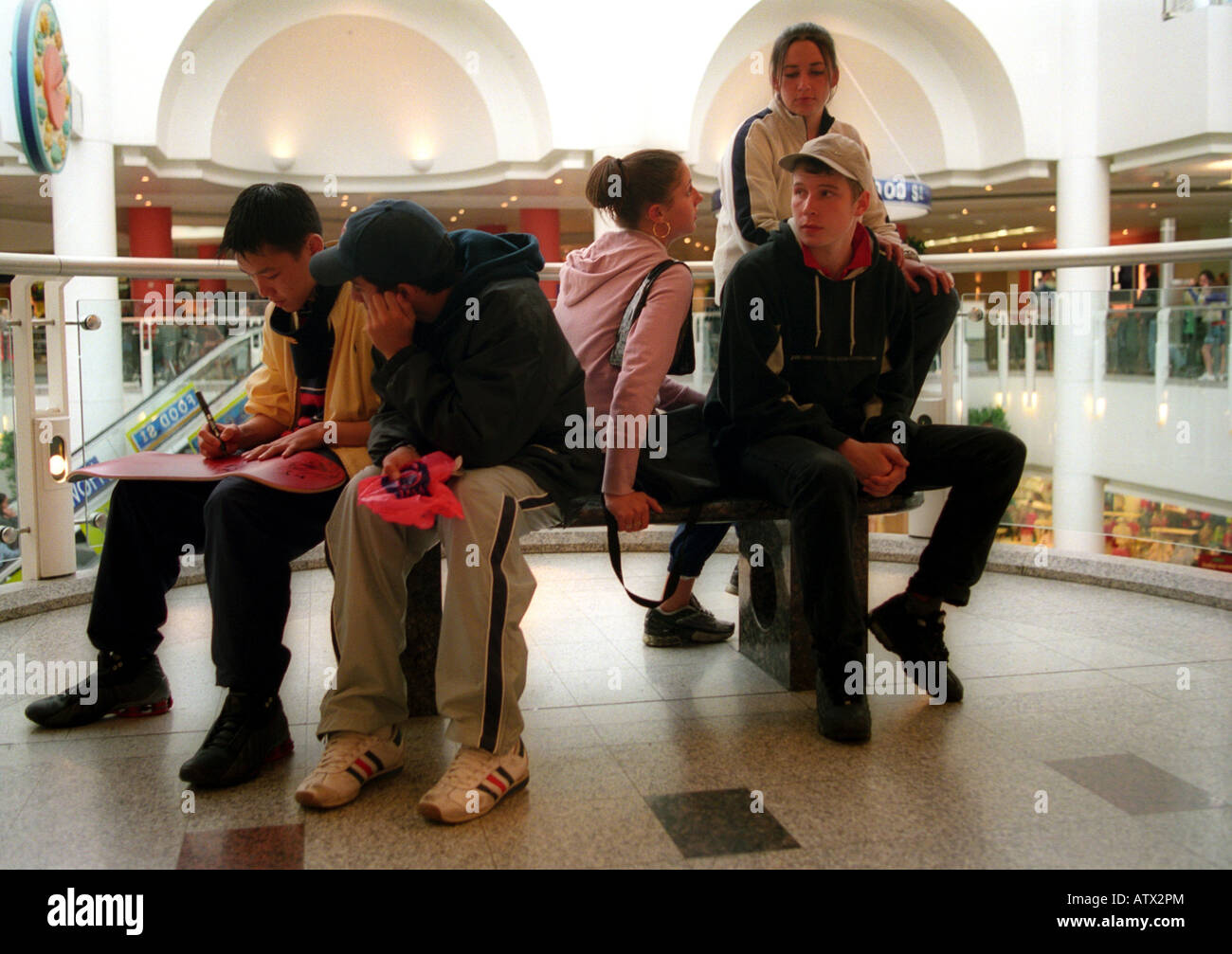 Teenagers hanging around shopping centre in Kingston London Stock Photo ...