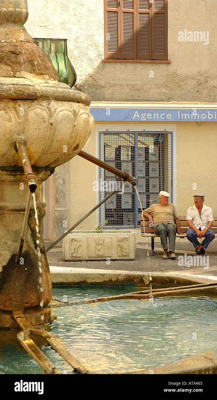 Sitting by the fountain Flayosc Var France Stock Photo - Alamy