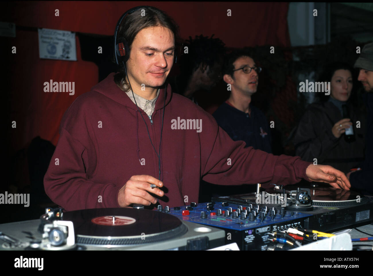 DJ at work mixing music with turntable Stock Photo - Alamy