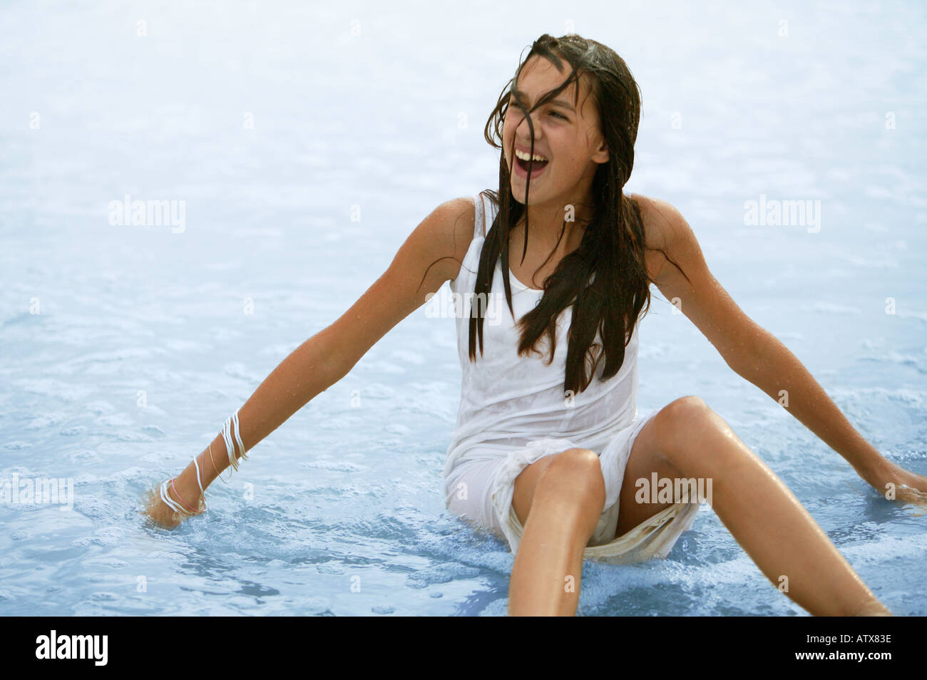Laughing girl in surf hi-res stock photography and images - Alamy