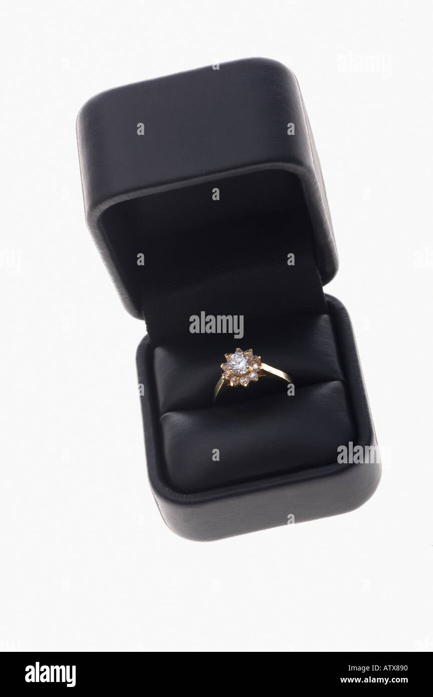 Still life of a Diamond engagement ring in box Isolated on a white ...
