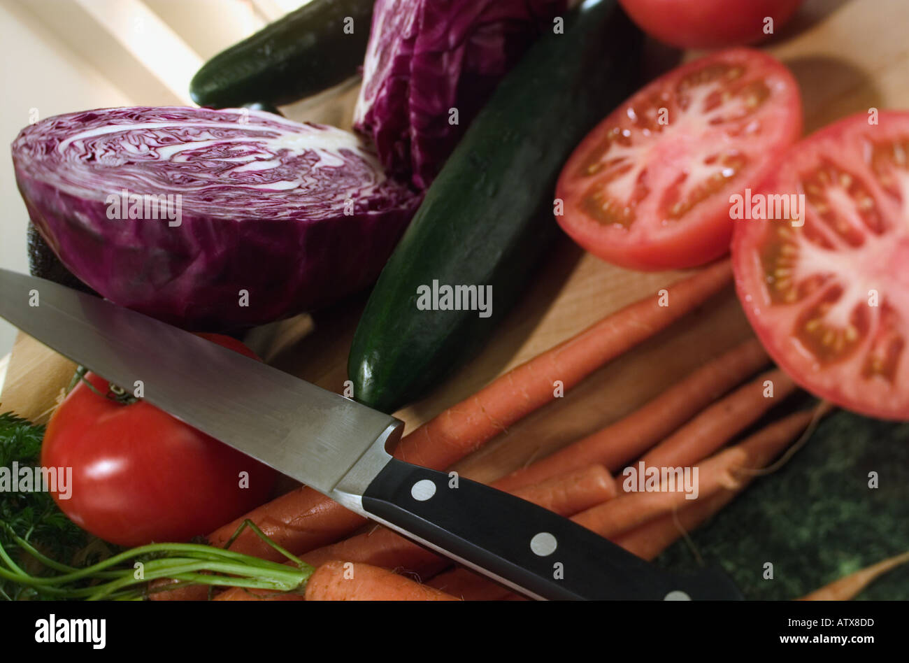 Still life of vegetables being cut up Stock Photo - Alamy