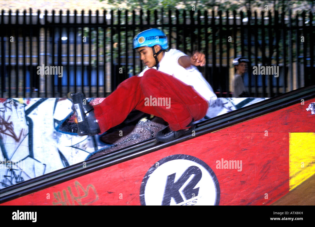 Young boy on inline skates on ramp Stock Photo - Alamy