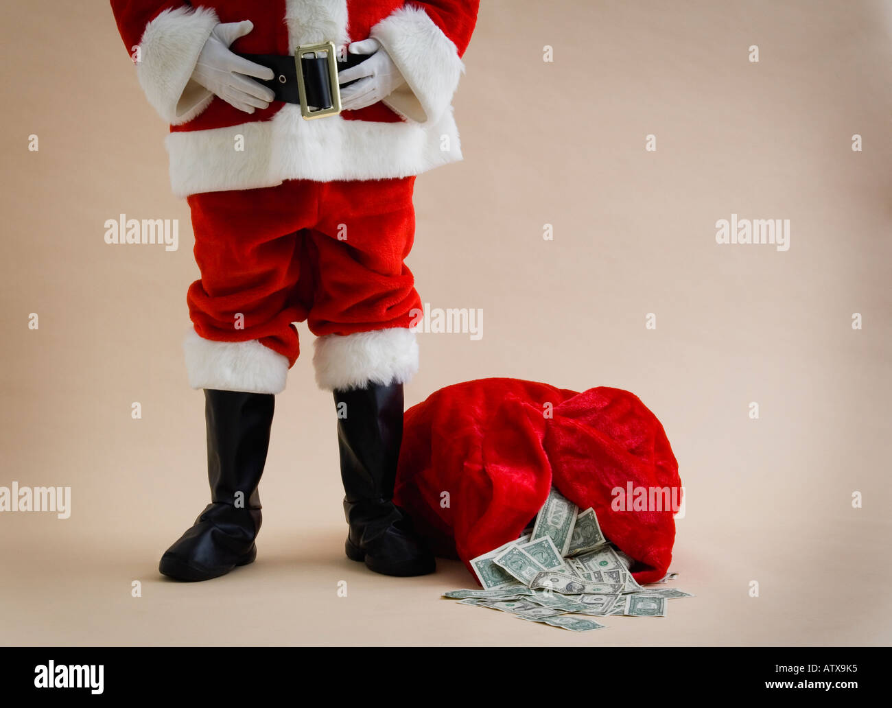 Santa with bag of money Stock Photo - Alamy