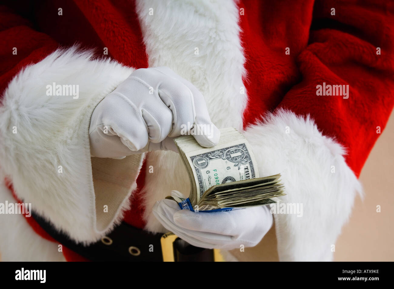 Santa counting money Stock Photo - Alamy