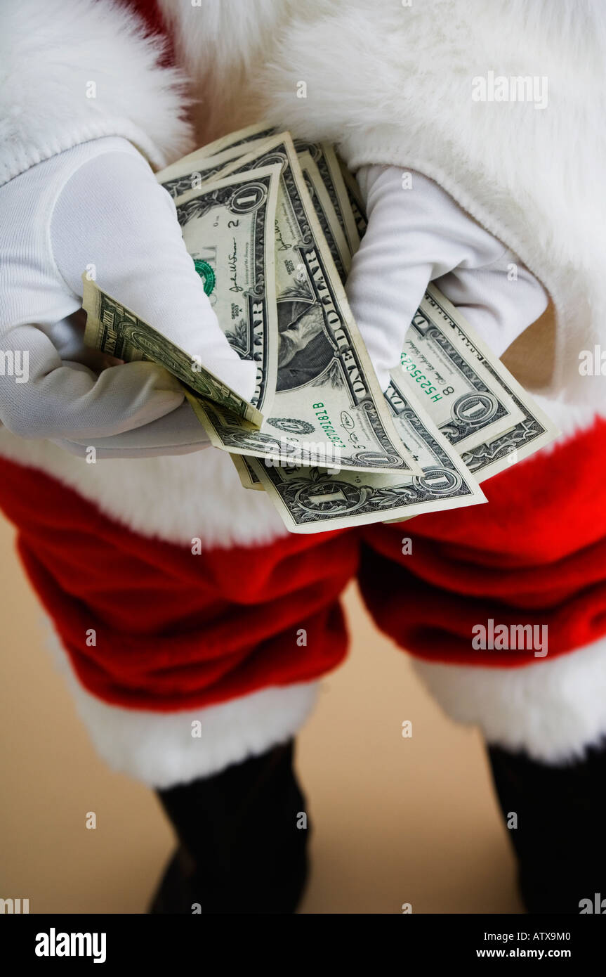 Santa counting money Stock Photo - Alamy
