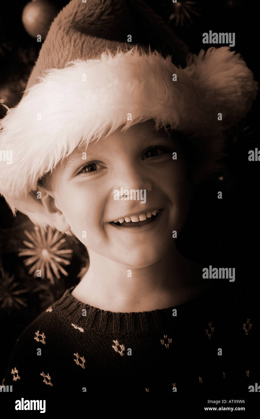 Boy wearing Santa hat Stock Photo - Alamy