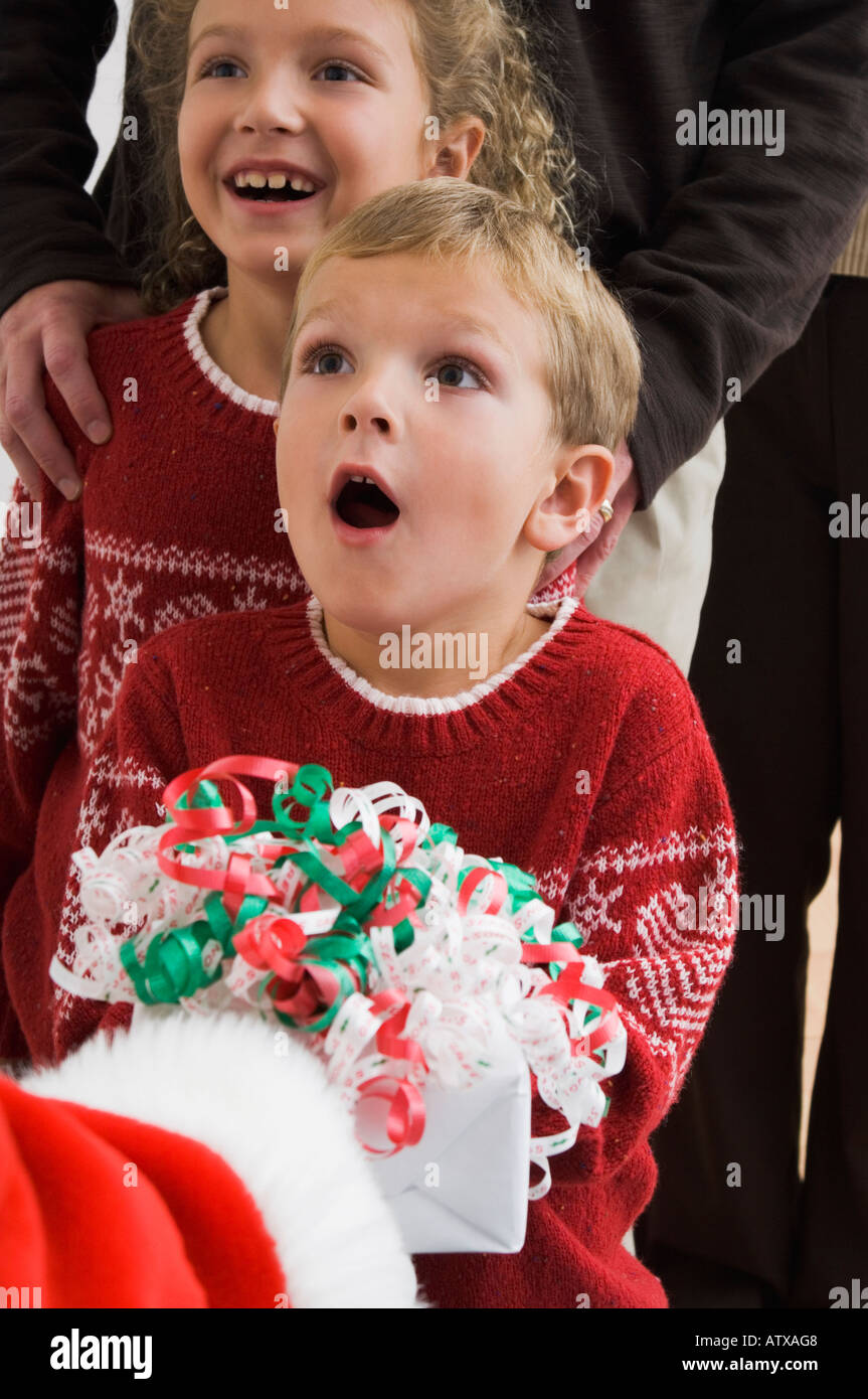 Boy getting a gift from Santa Stock Photo - Alamy