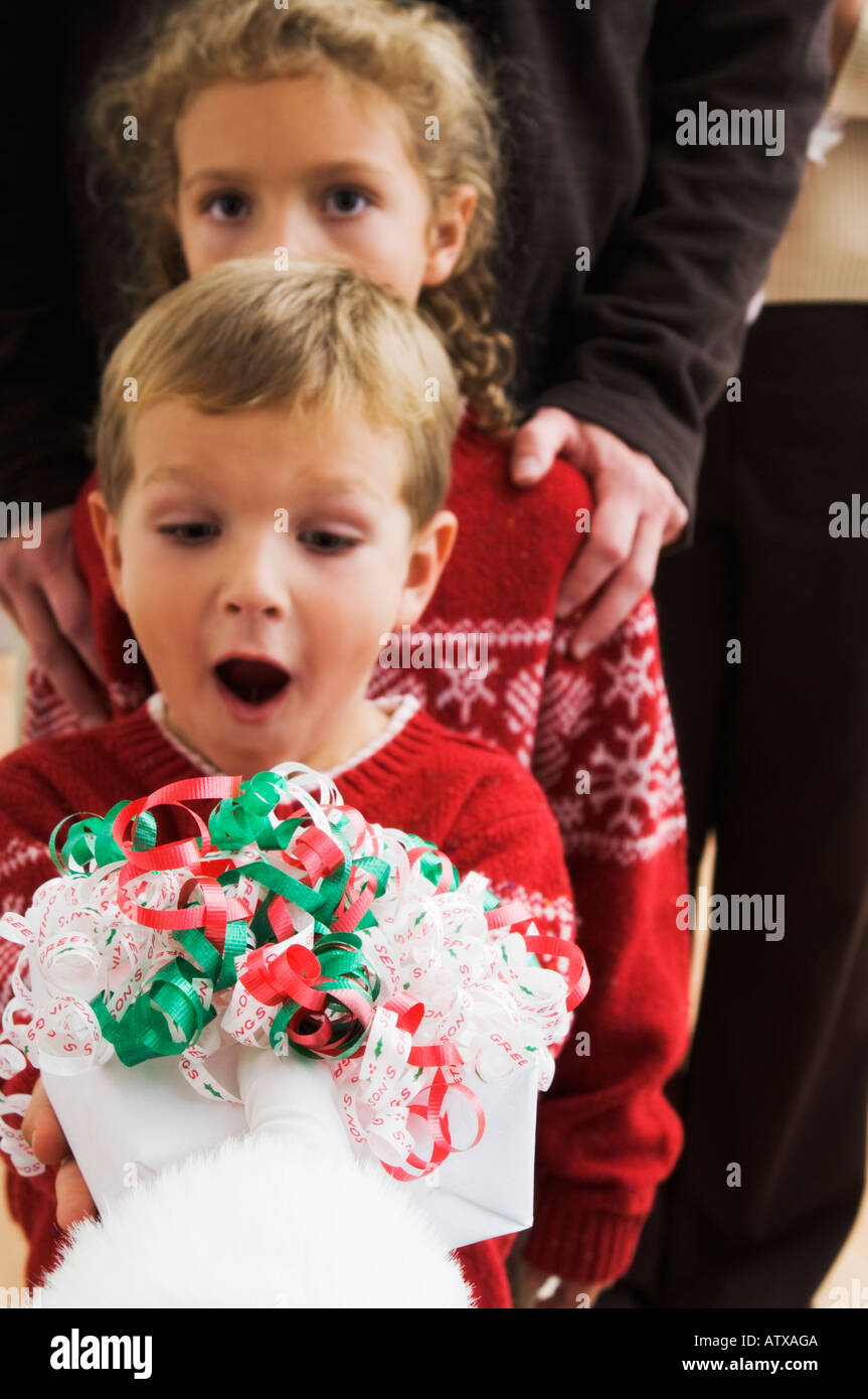 Boy getting a gift from Santa Stock Photo - Alamy