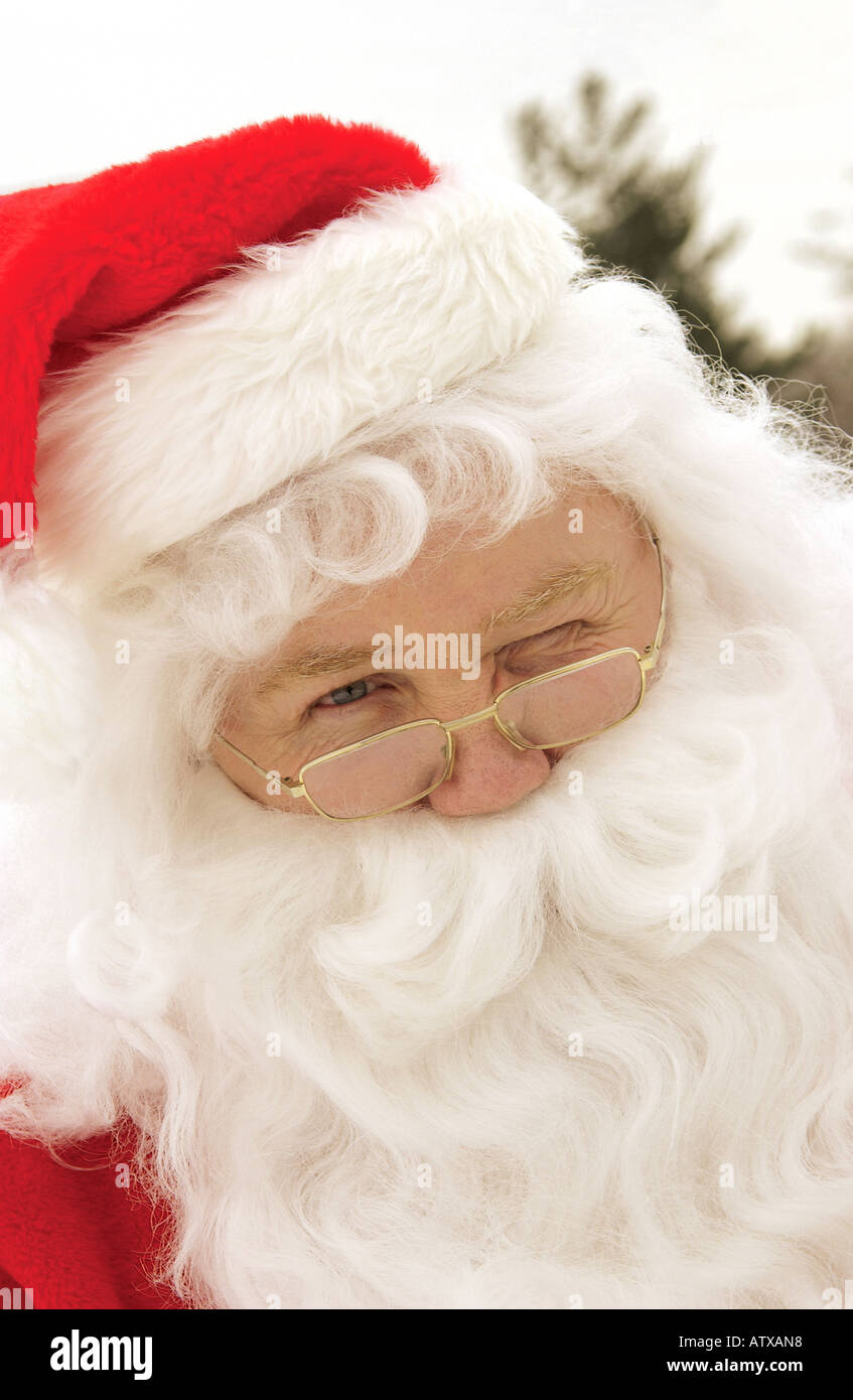 Santa Claus winking Stock Photo - Alamy