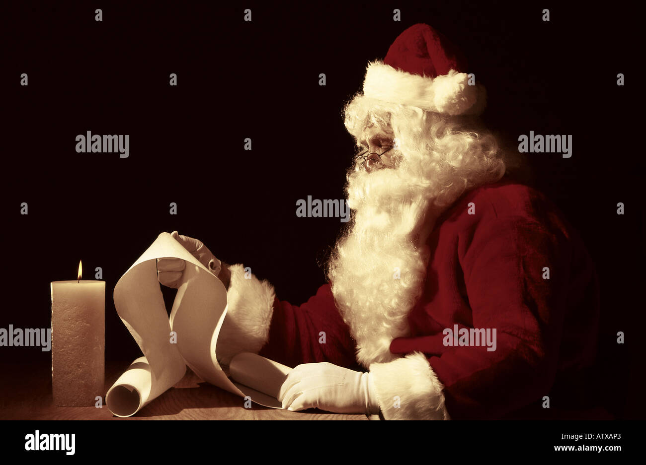 Santa making a list Stock Photo - Alamy