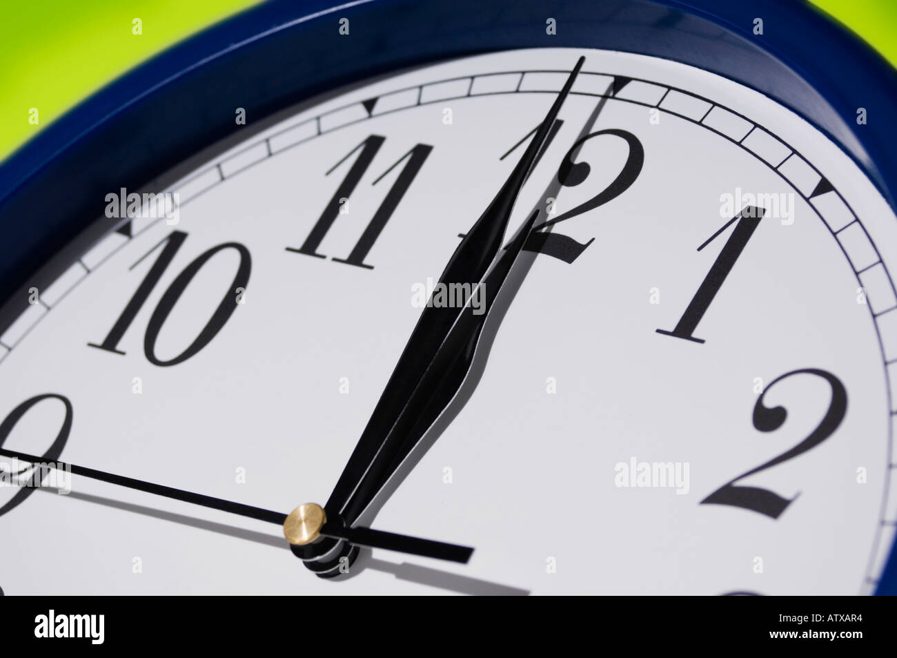 Clock turning midnight Stock Photo - Alamy