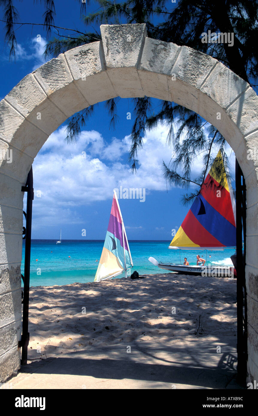 Barbados beach Caribbean Beach sailboats and trees seen through an arch ...