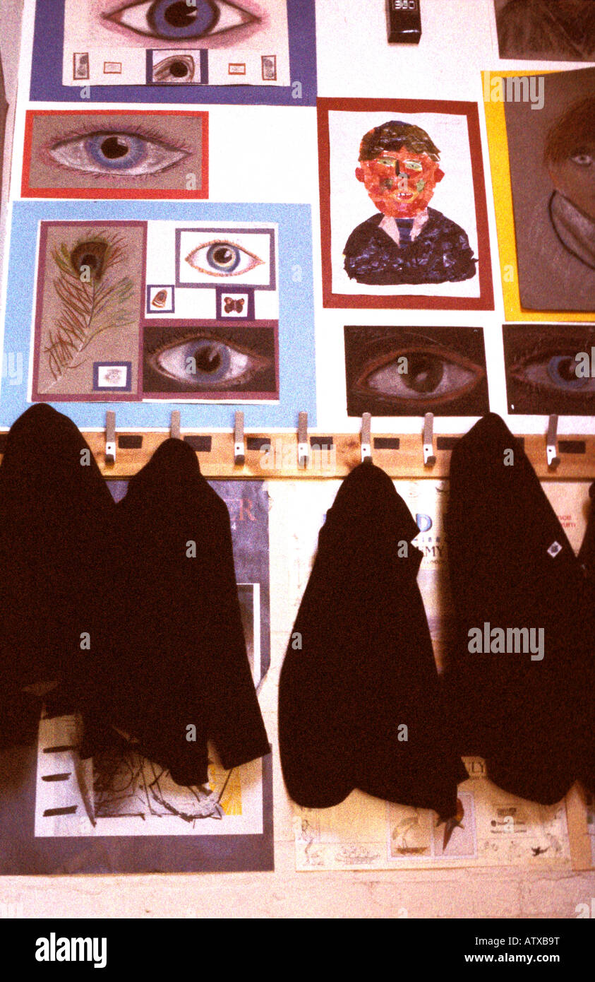 School coats and jackets hanging in school corridor Stock Photo - Alamy