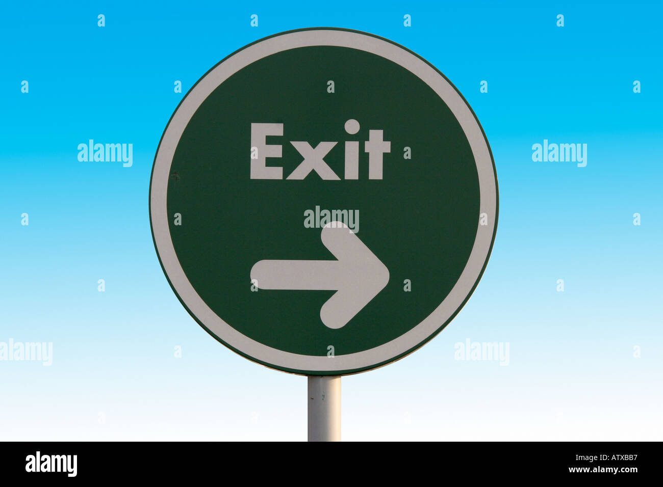 green exit sign with blue background Stock Photo - Alamy