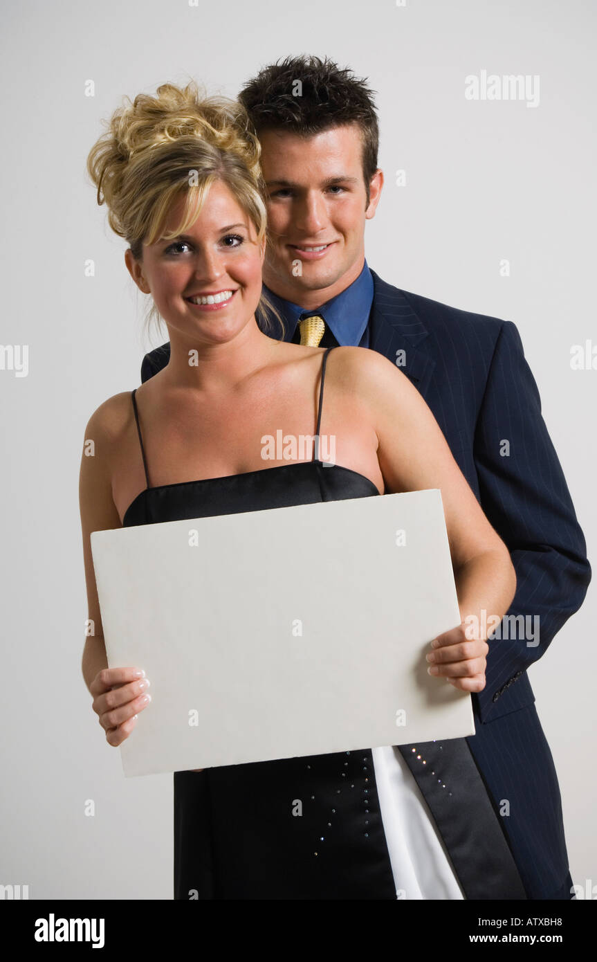 Couple holding blank sign Stock Photo - Alamy