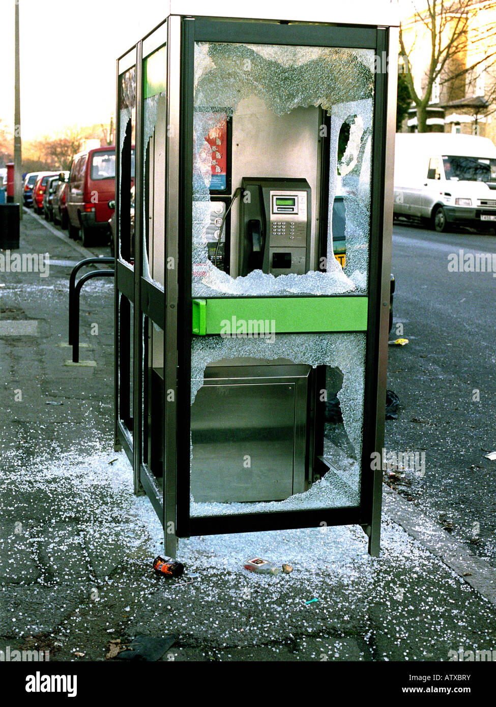 Vandalised phone box with shattered glass Stock Photo - Alamy