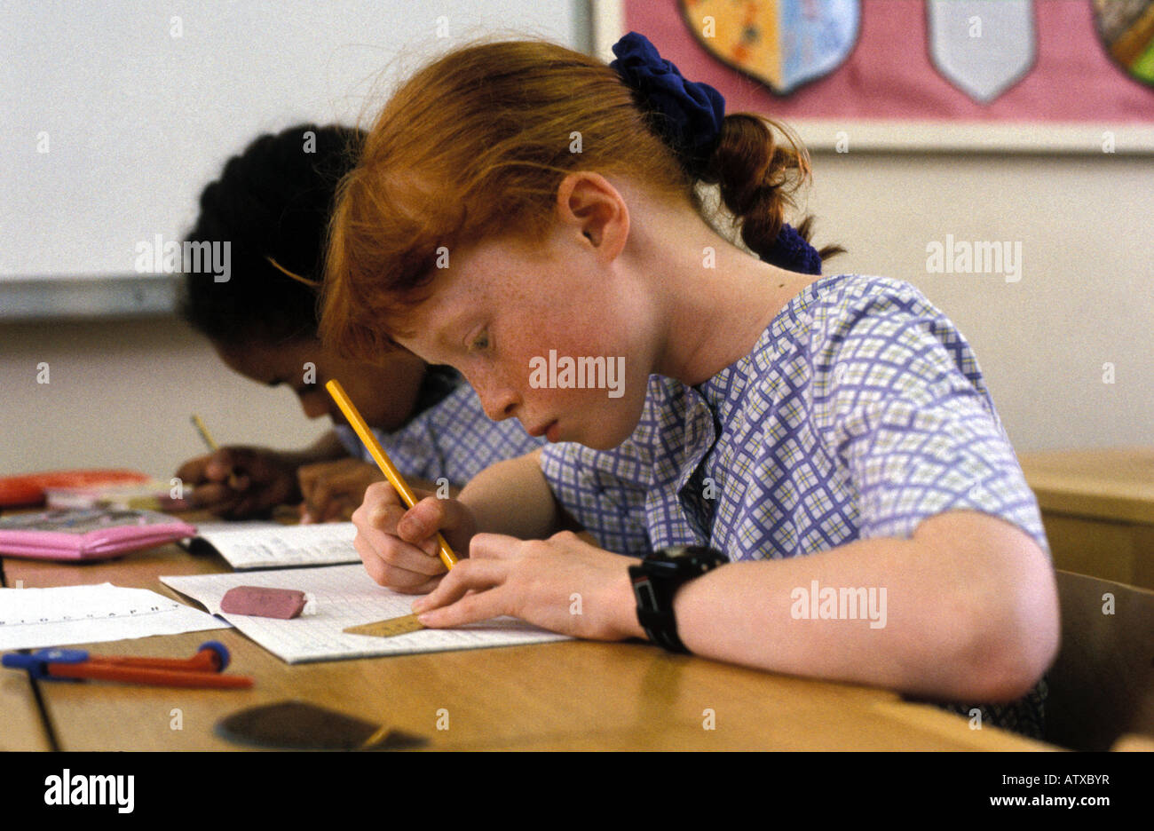 Young girl working on test paper at South London private primary school ...